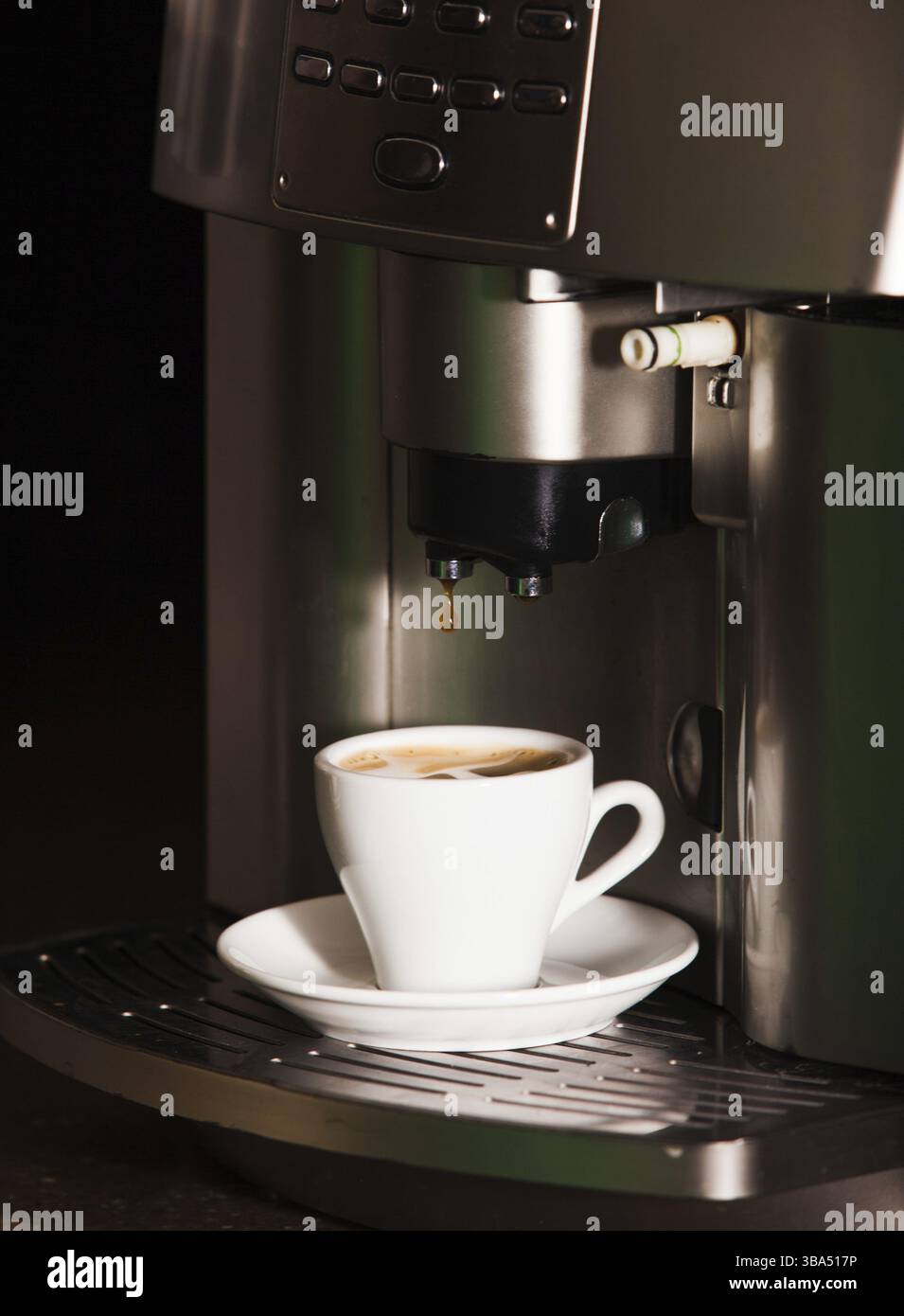 Coffee machine brewing a coffee espresso in home Stock Photo - Alamy