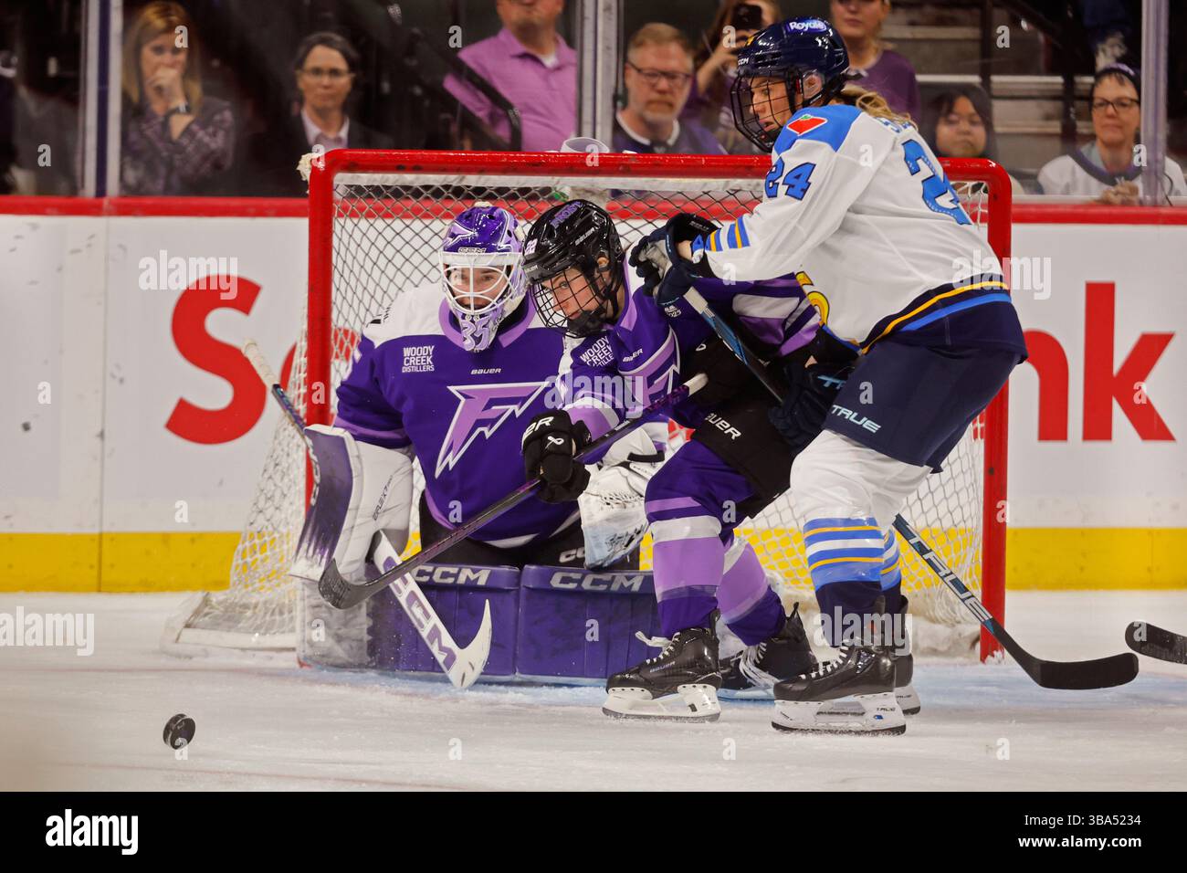 Minnesota Frost defender Natalie Buchbinder, center, clears the puck in ...