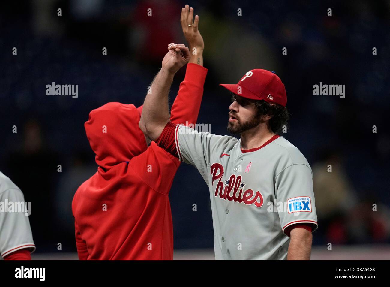 Philadelphia Phillies relief pitcher Jordan Romano, right, gets high ...