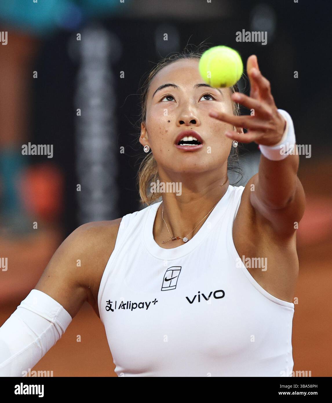 Rome, Italy. 11th May, 2025. Zheng Qinwen serves during the women's singles round of 32 match ...