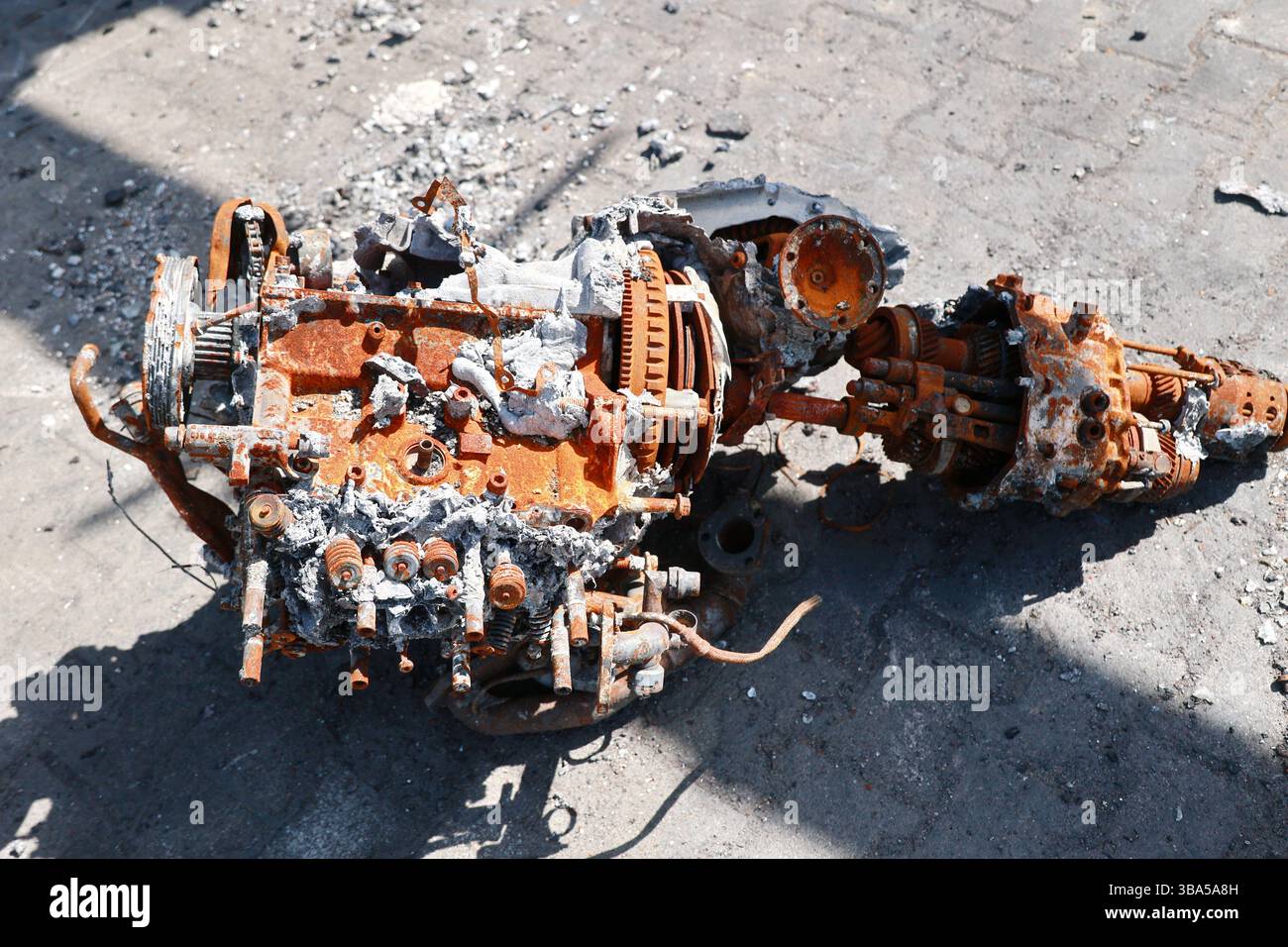 A rusted engine is laying on the ground Stock Photo - Alamy