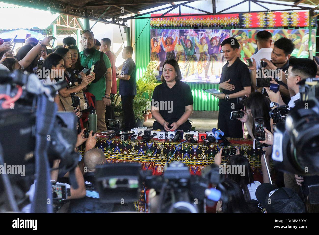 Philippine Vice President Sara Duterte, center, speaks to the media ...