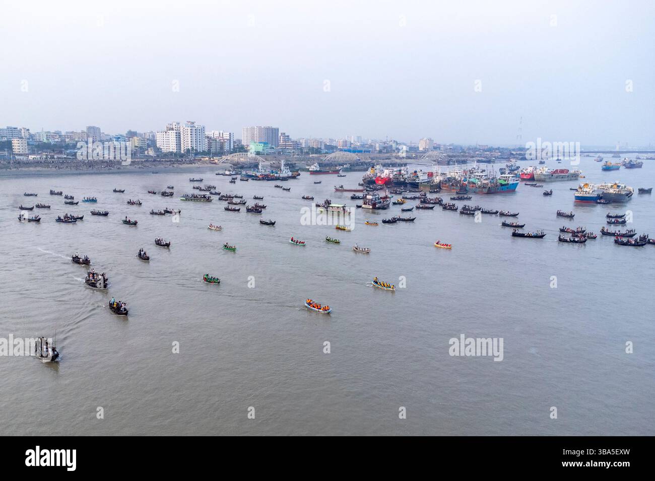 Boat races in Bangladesh. Traditional Sampan race in Karnaphuli River ...
