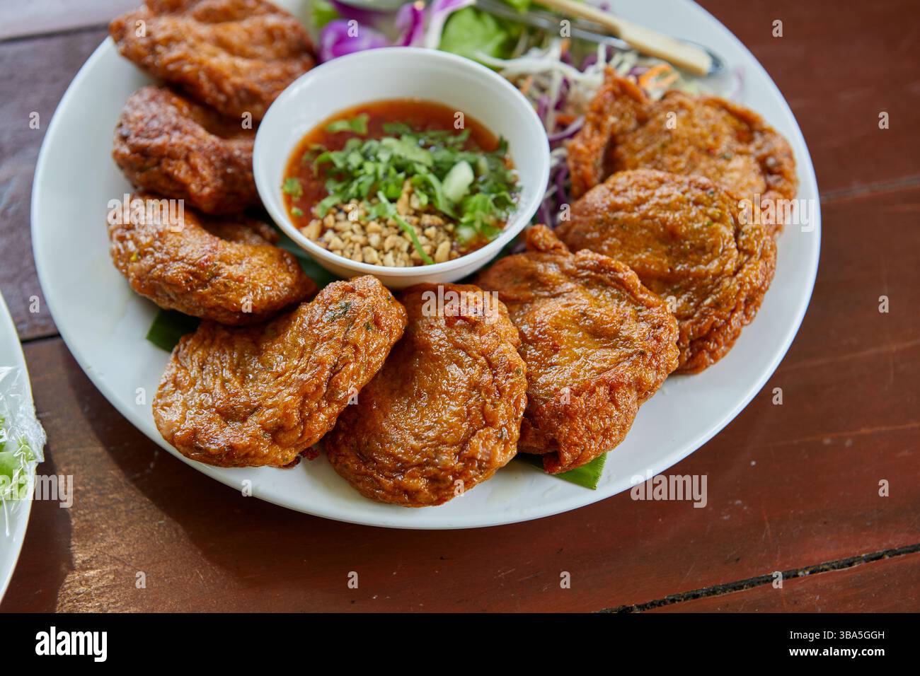 Fried fish-paste balls or deep fried fish cake with sweet sauce on ...