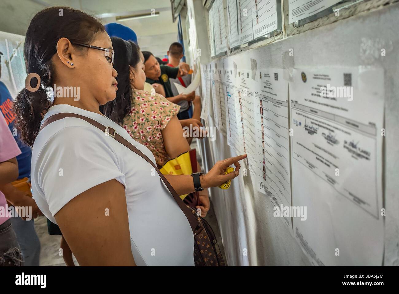 Antipolo City, Philippines. 12th May, 2025. Voters find their names and ...