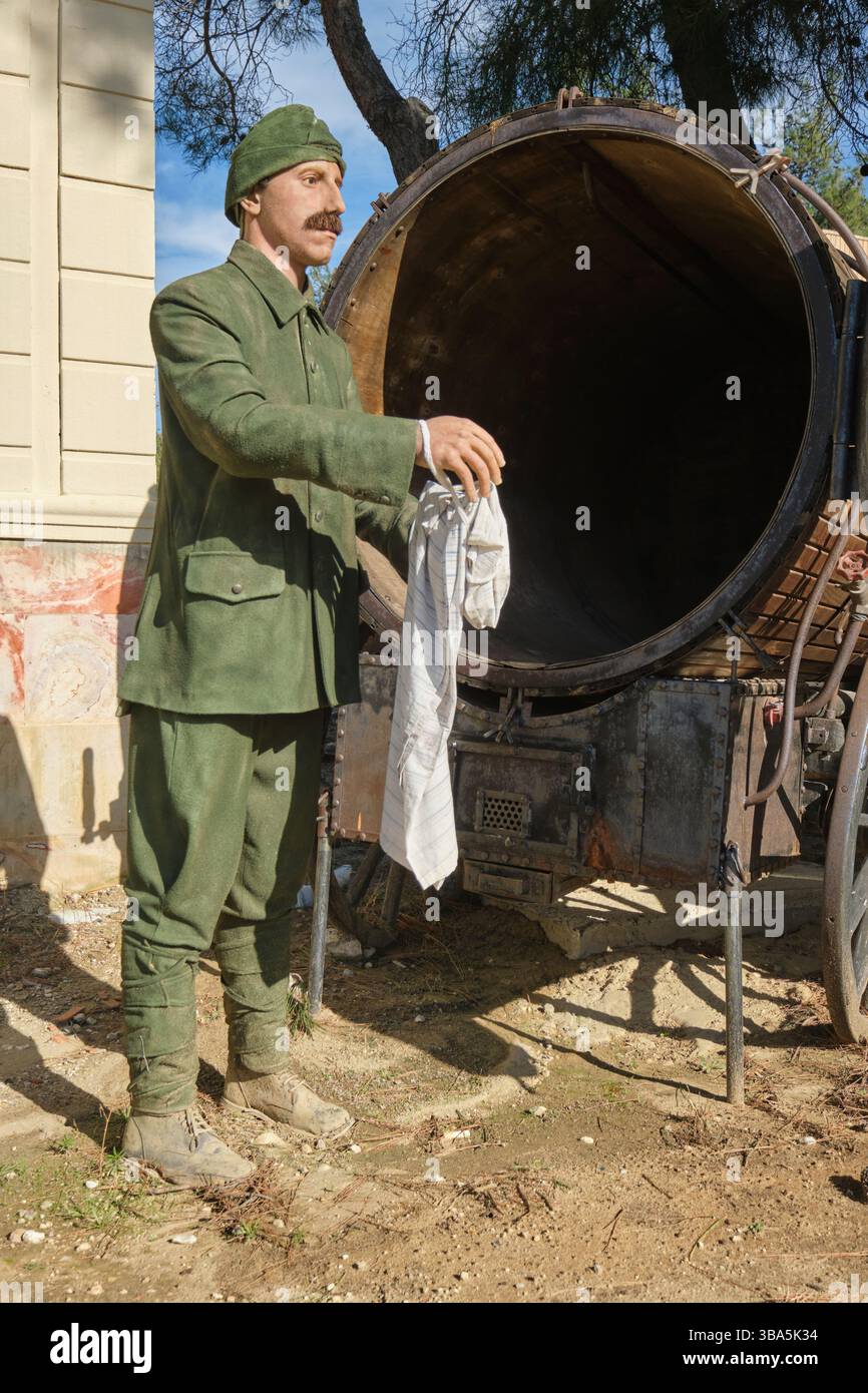 A Turkish soldier washing, doing laundry, sanitizing a rag, towel ...