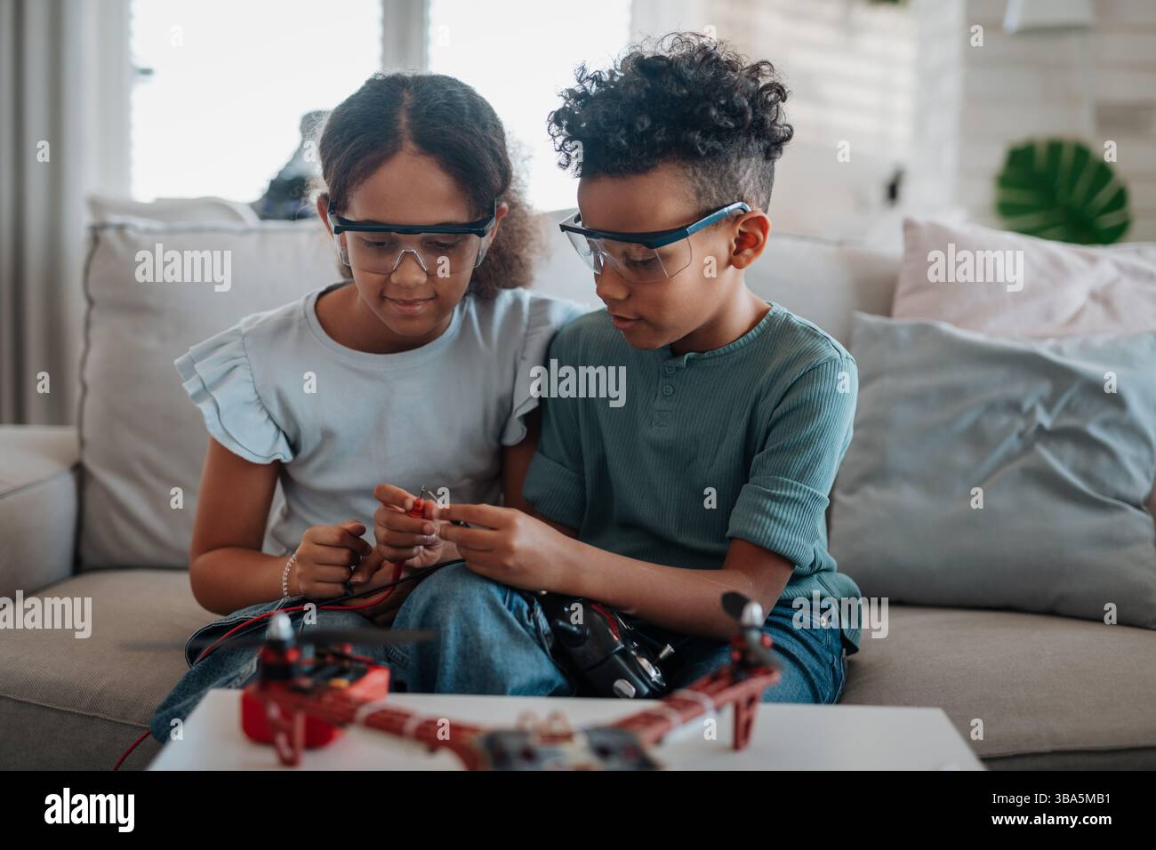 Kids building their first homemade robot at home Stock Photo - Alamy