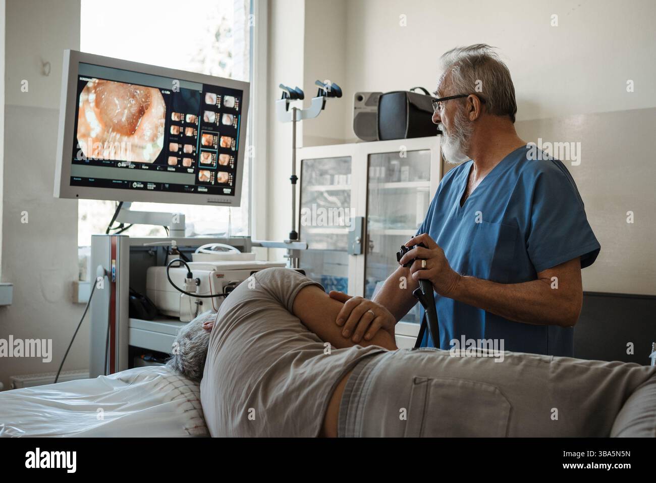 Gastroscopy procedure on sedated patient to examine upper digestive ...