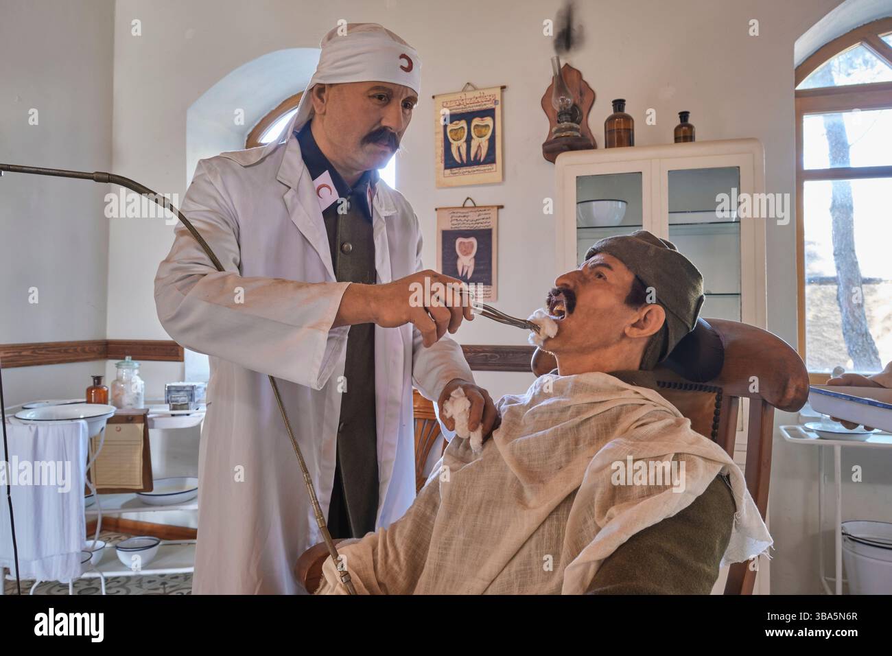 An army dentist with nurse, working on the teeth of a wounded Turkish ...