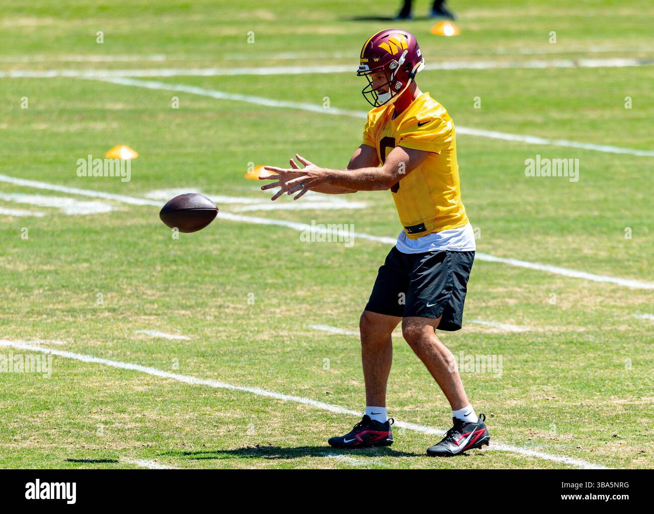 Quarterback Nathan Peterman receives the snap during warm ups at Rookie Camp at the ...
