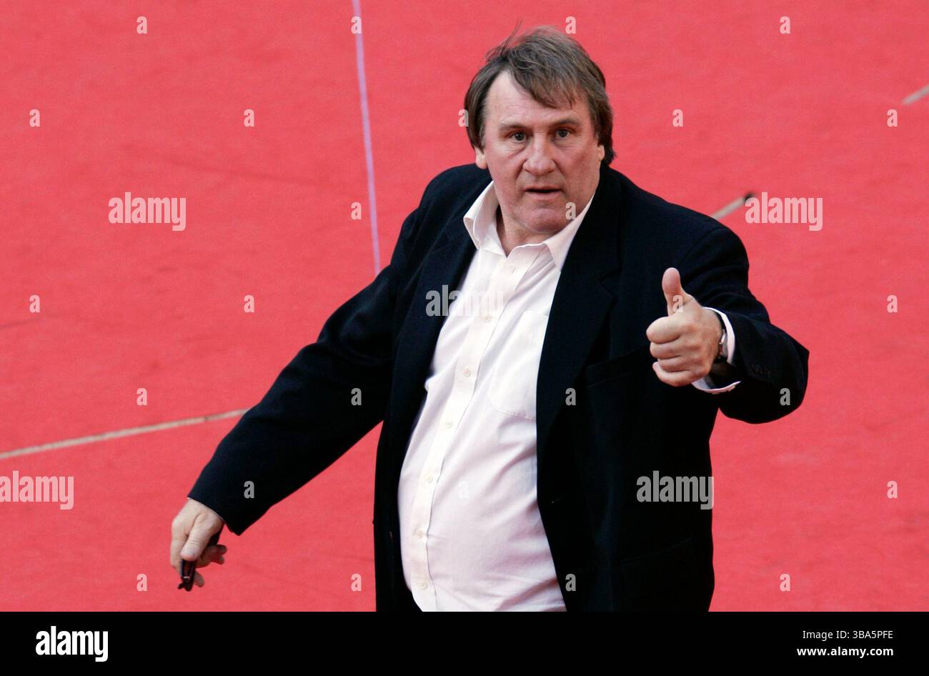FILE - French actor Gerard Depardieu poses for photographers on the red ...