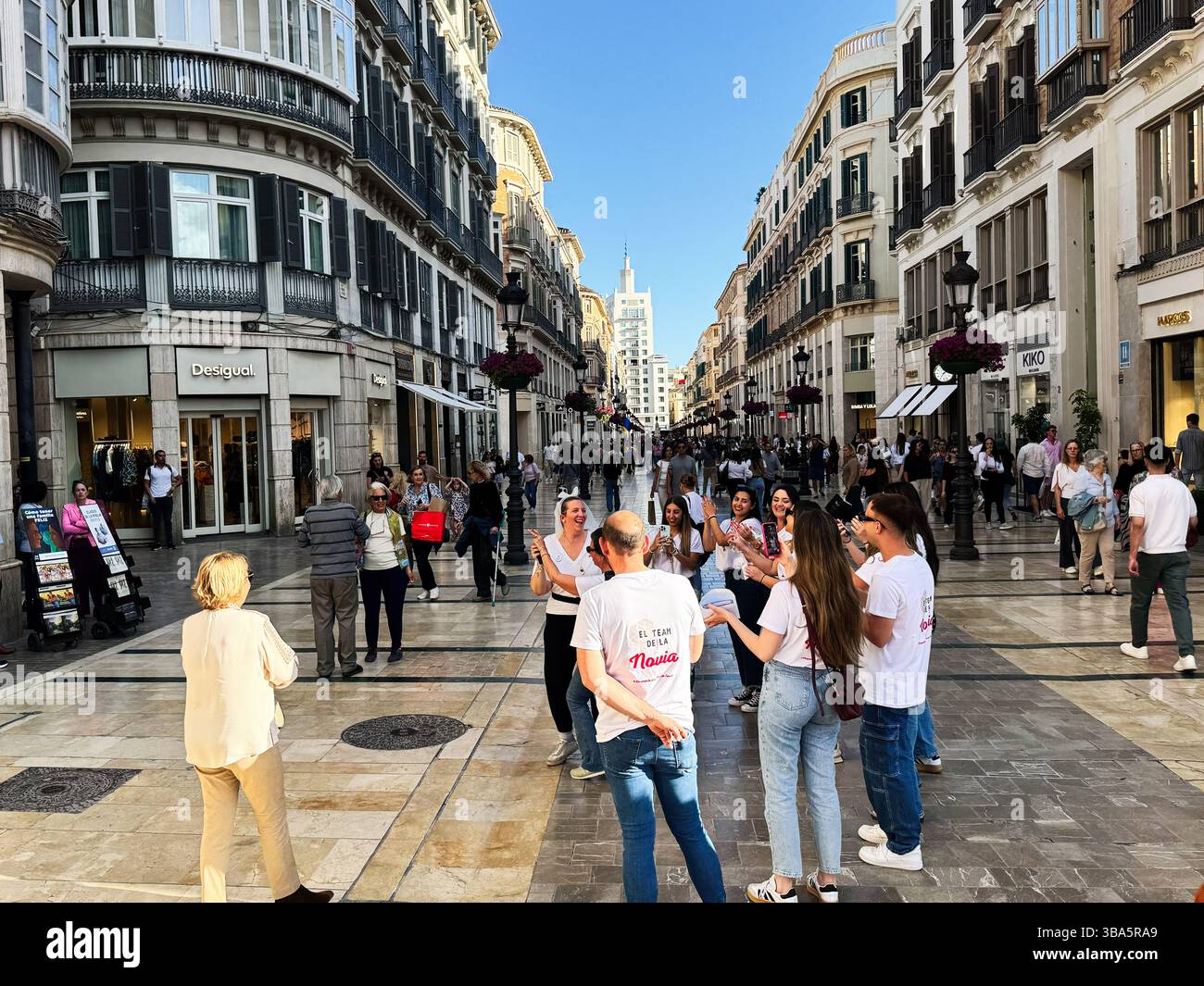Malaga, Spain - May 02, 2025: Crowded street in Malaga with groups of ...