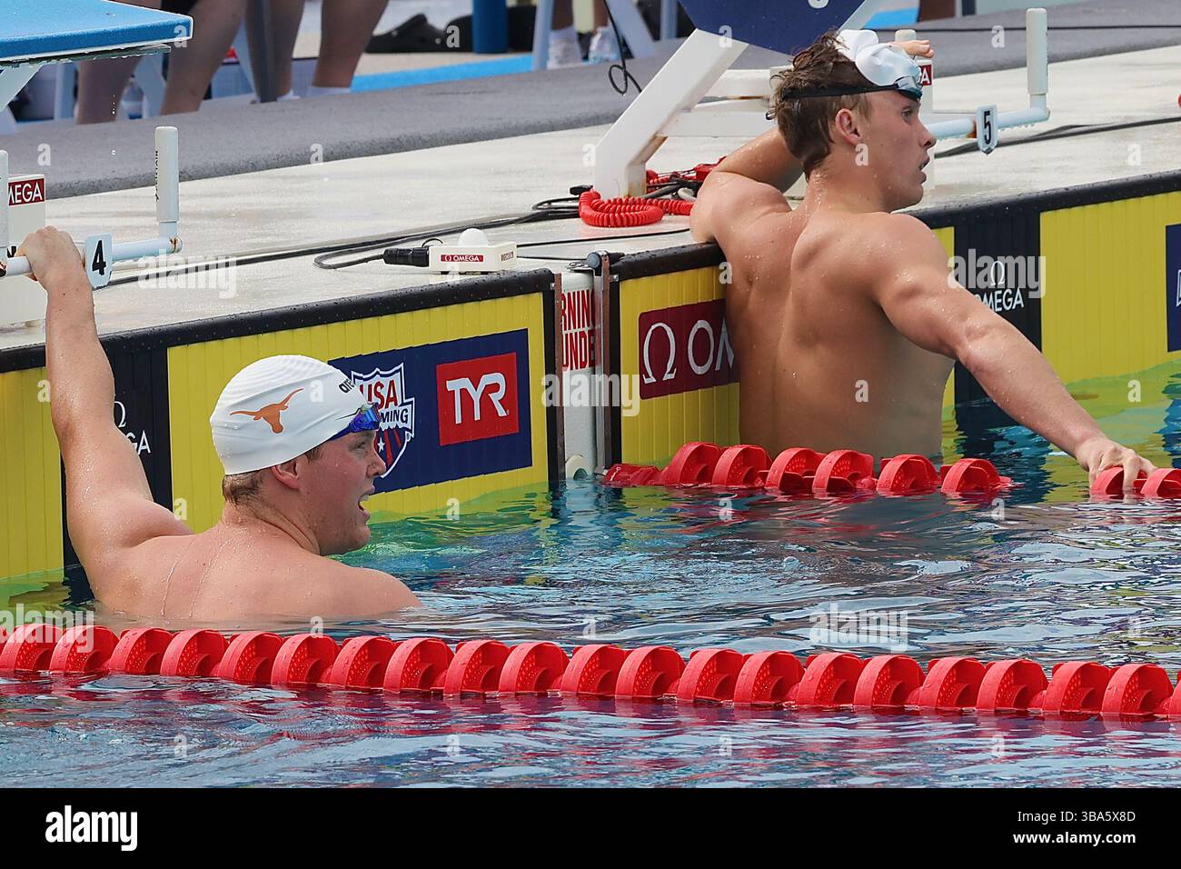 Luke Hobson (let) and Carson Foster (right) swim in the Men’s 200 meter ...