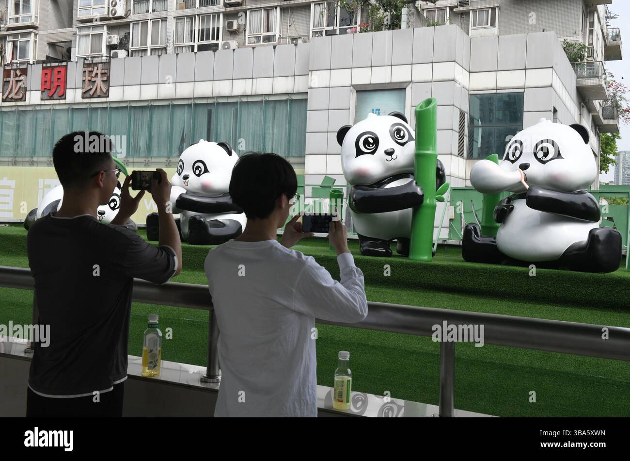 The panda themed elements of the station attract tourists to take ...