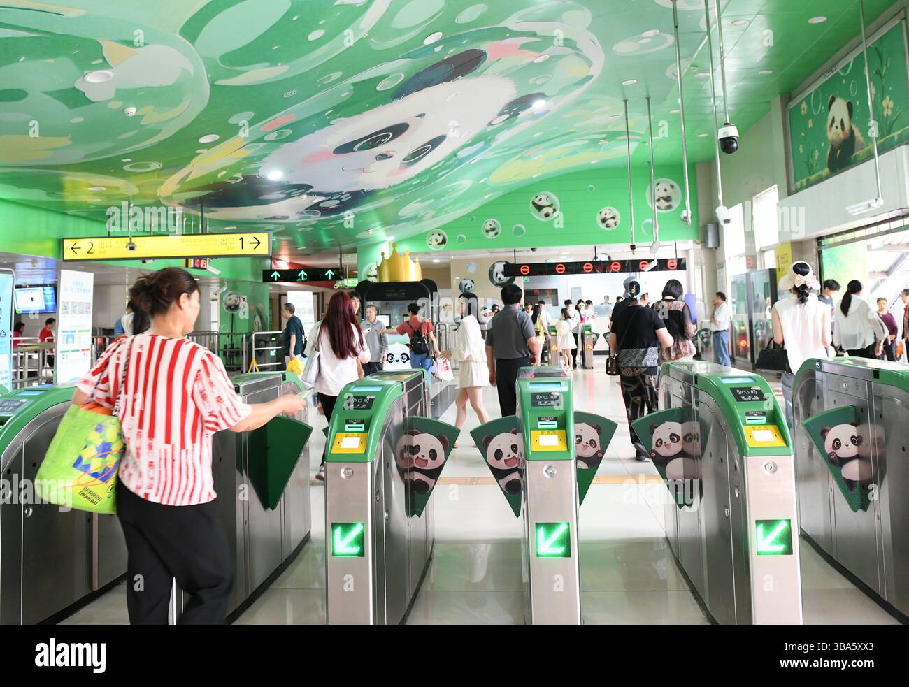 The panda themed elements inside the subway station attract passengers ...