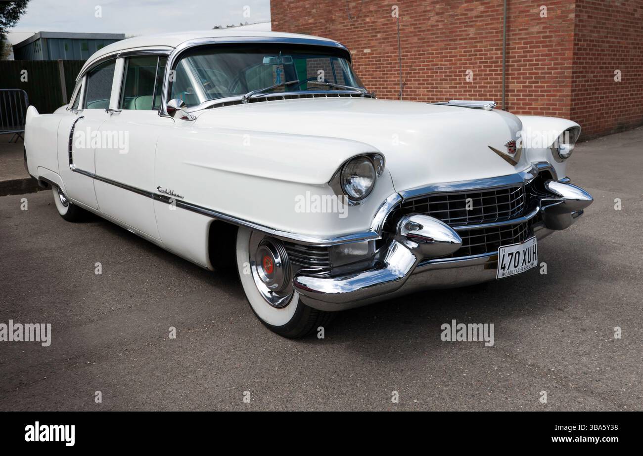 Three-quarters front view of a White, 1955, Cadillac Series 62, on ...