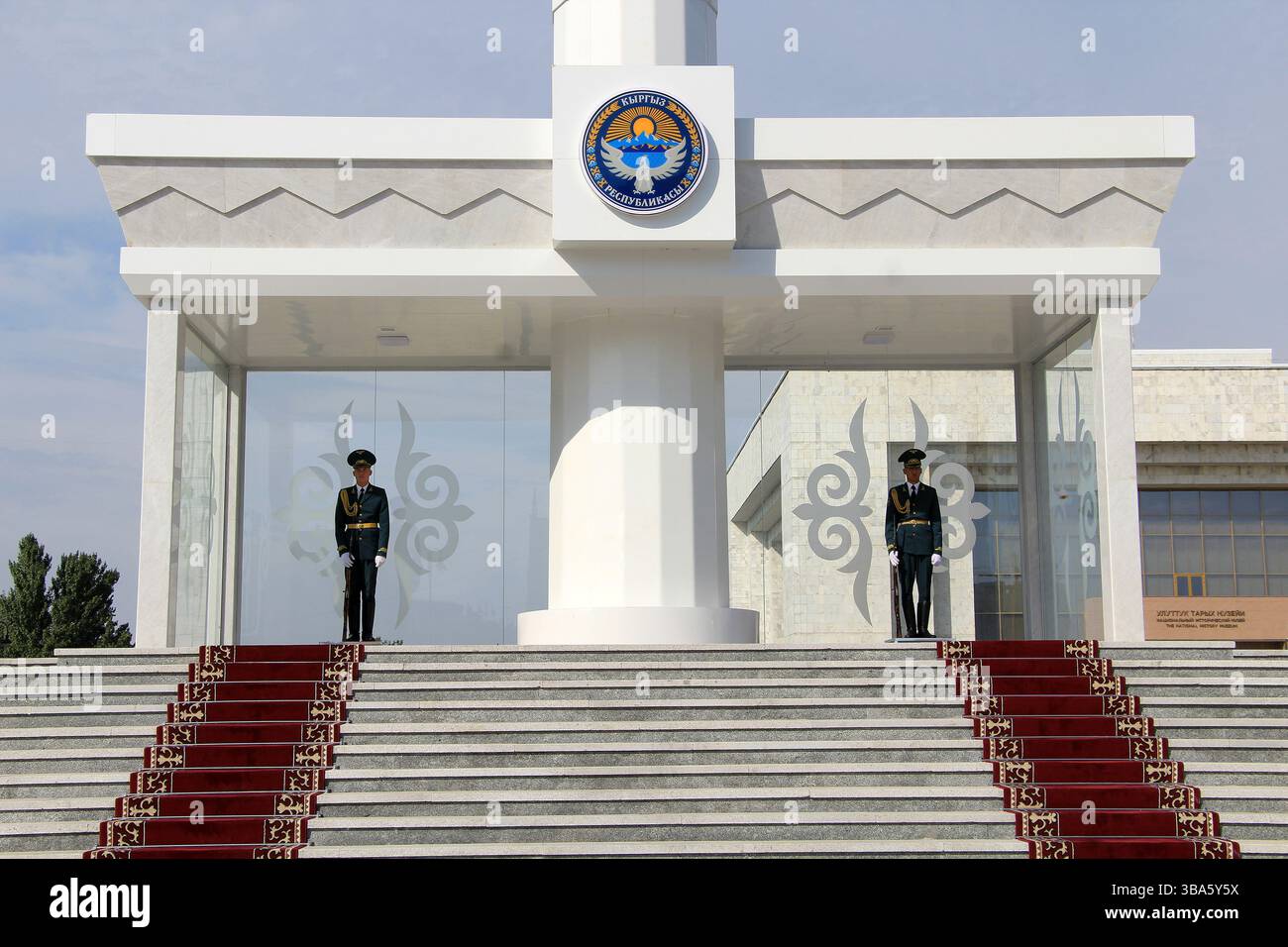 Soldiers stand guard in the city square of Bishkek. The guard post is ...