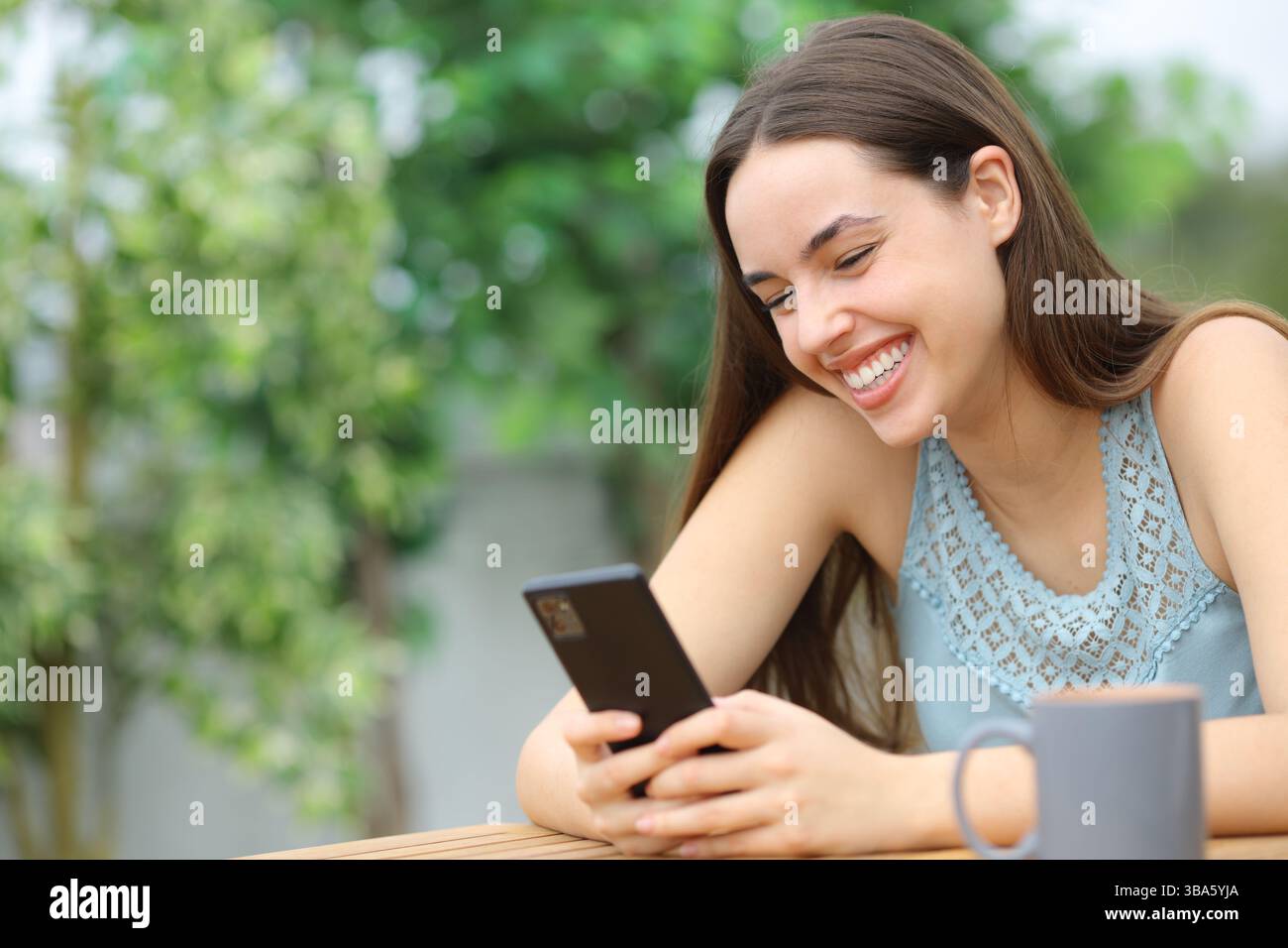 Mobile woman garden outside hi-res stock photography and images - Alamy