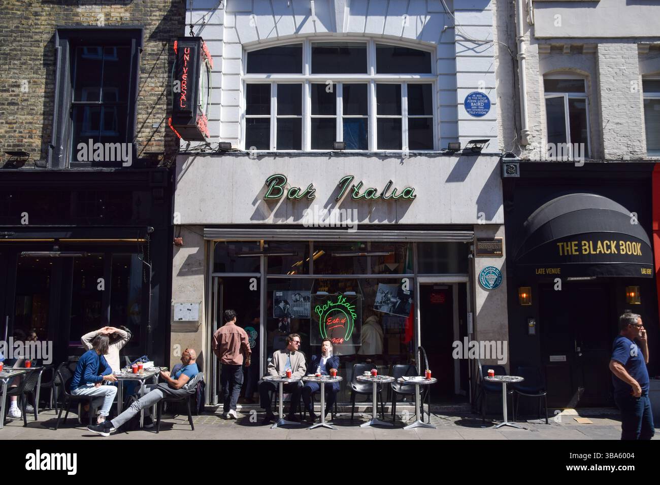 London, UK. 9th May 2025. People sit outside Bar Italia in Frith Street ...