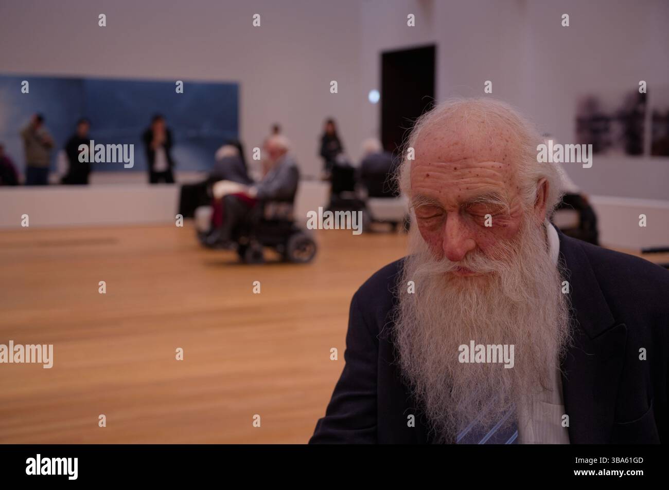 Hyperrealistic elderly figure with closed eyes and a long white beard ...