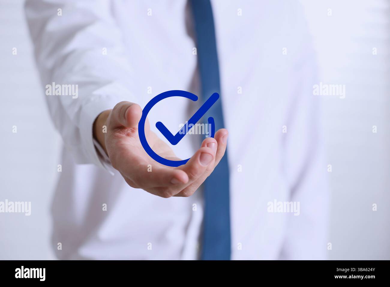Approved. Man holding virtual check mark in hand on white background ...