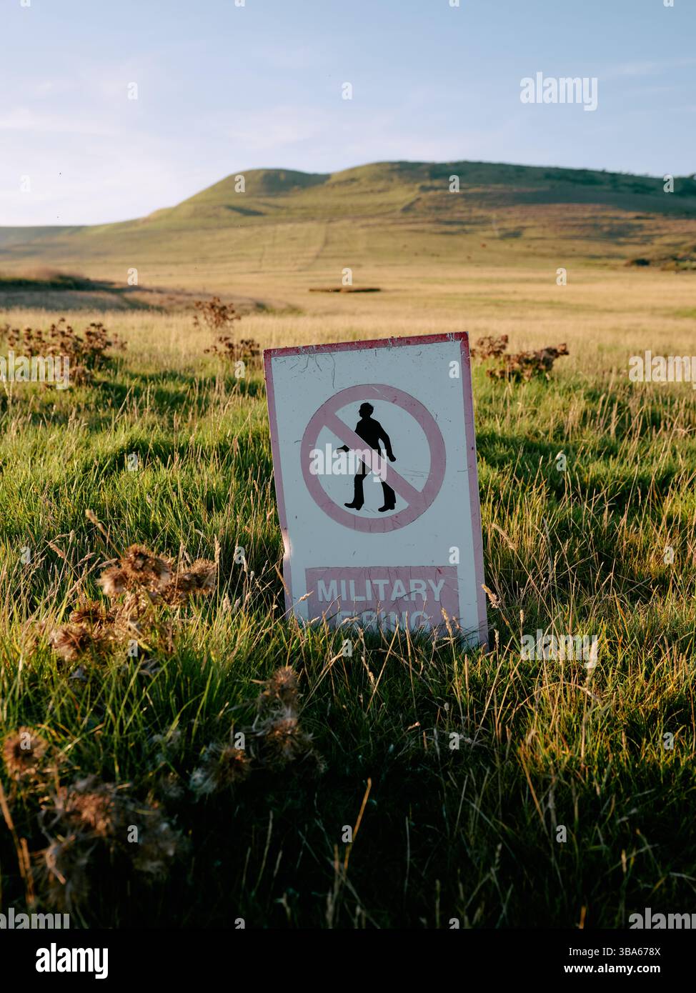 MOD Firing Range warning sign in the empty summer landscape of ...