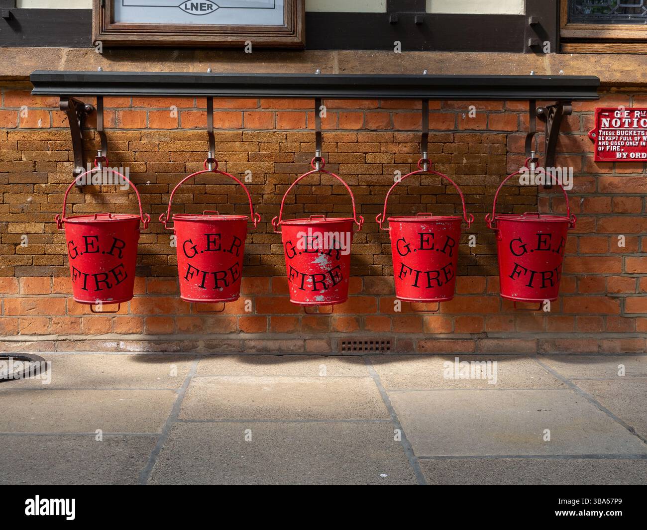 Red fire buckets on the platform at the Royal Station, Wolferton, near ...