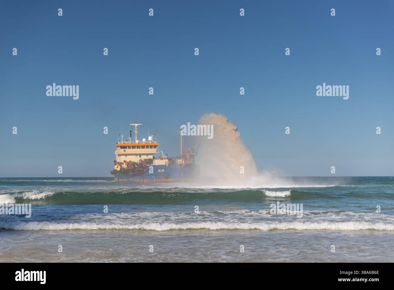 Dredging Ship Pumps Sand Under Clear Sky, Surfers Paradise Stock Photo ...