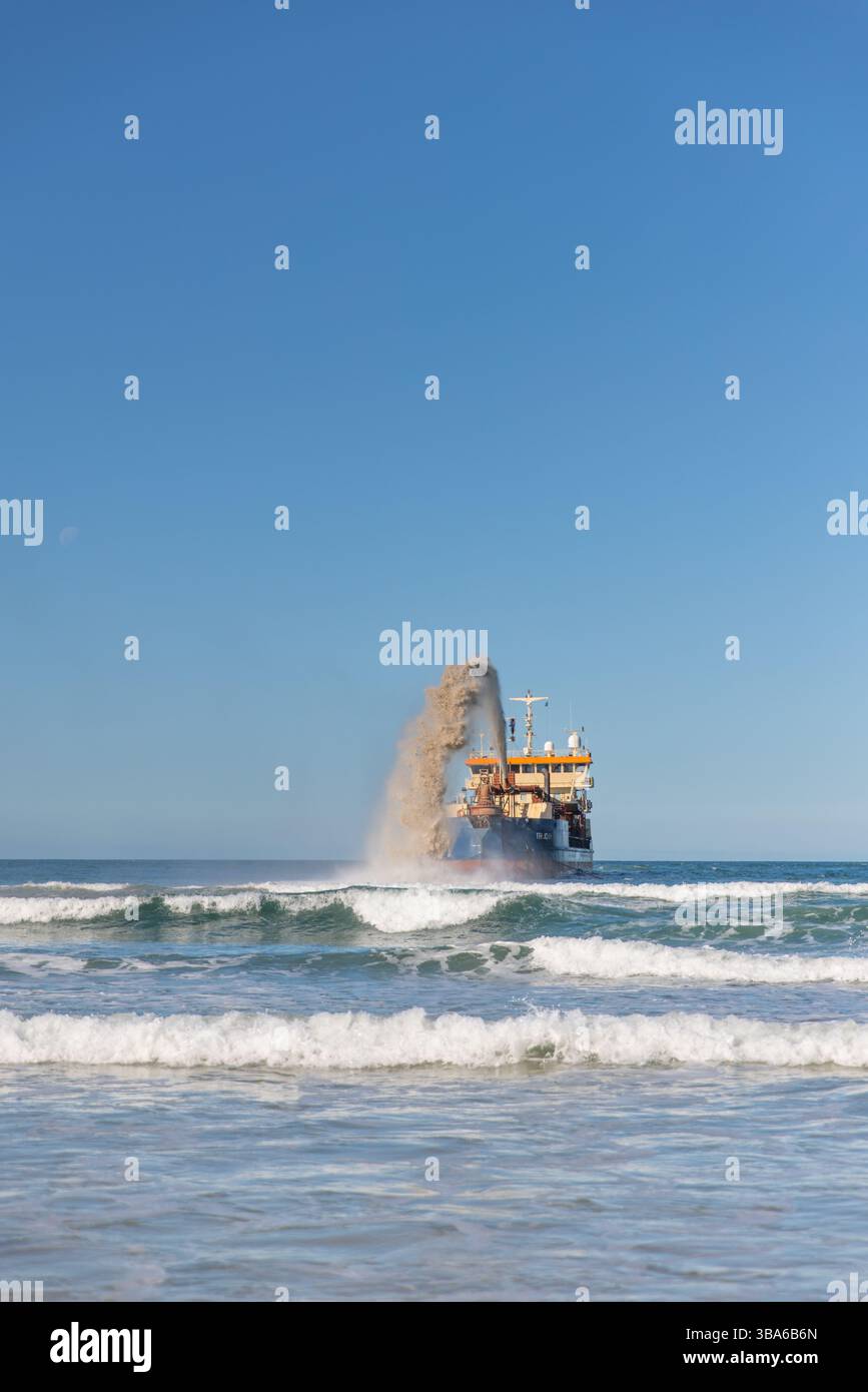 Front view of dredging barge pumping sand off Gold Coast Stock Photo ...