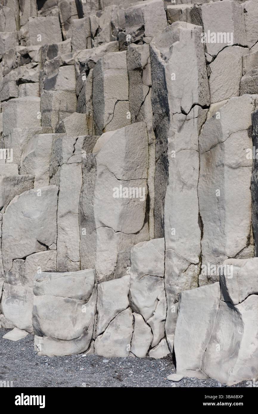 Pale basalt columns with vertical cracks and rough texture Stock Photo ...
