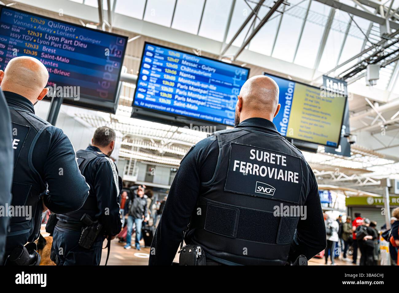 Rail safety worker in the field. “Sûreté ferroviaire” (Rail Safety) is ...
