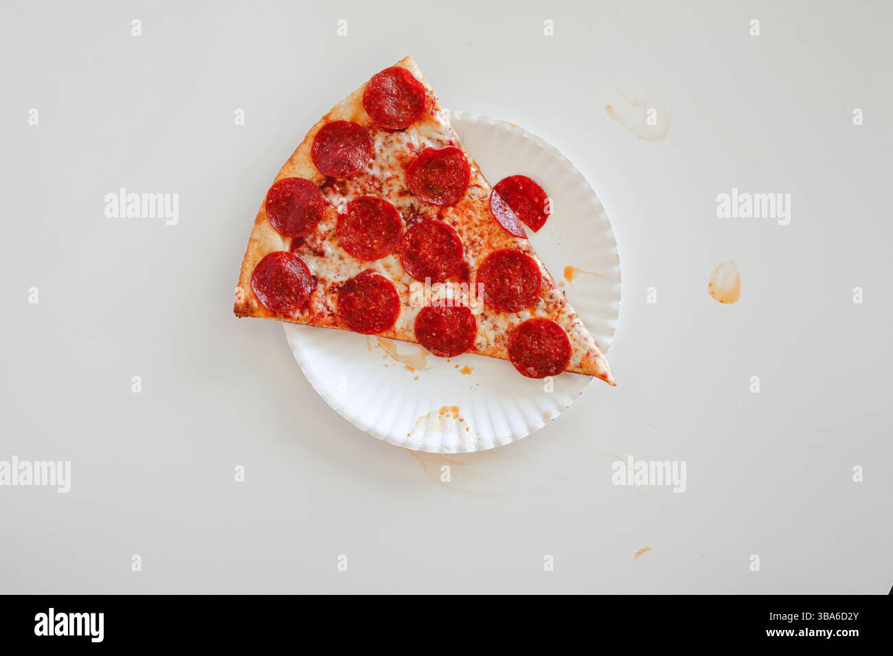 Slice of pizza from above looking down on white Stock Photo - Alamy
