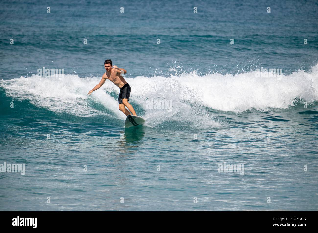Man surfing in honolulu hawaii hi-res stock photography and images - Alamy