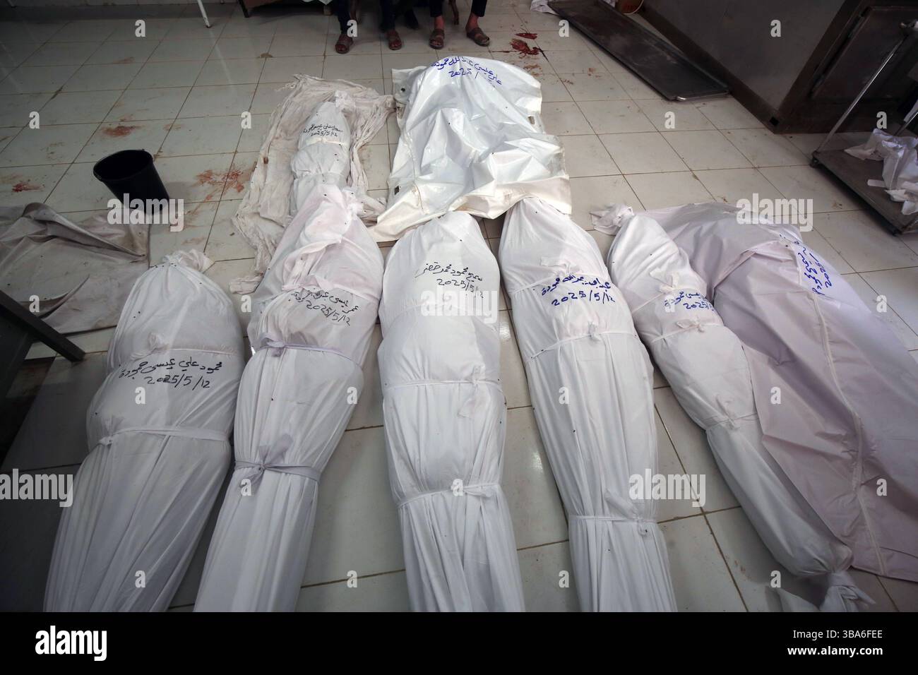 Palestinians mourn the loss of their loved ones killed in an Israeli ...