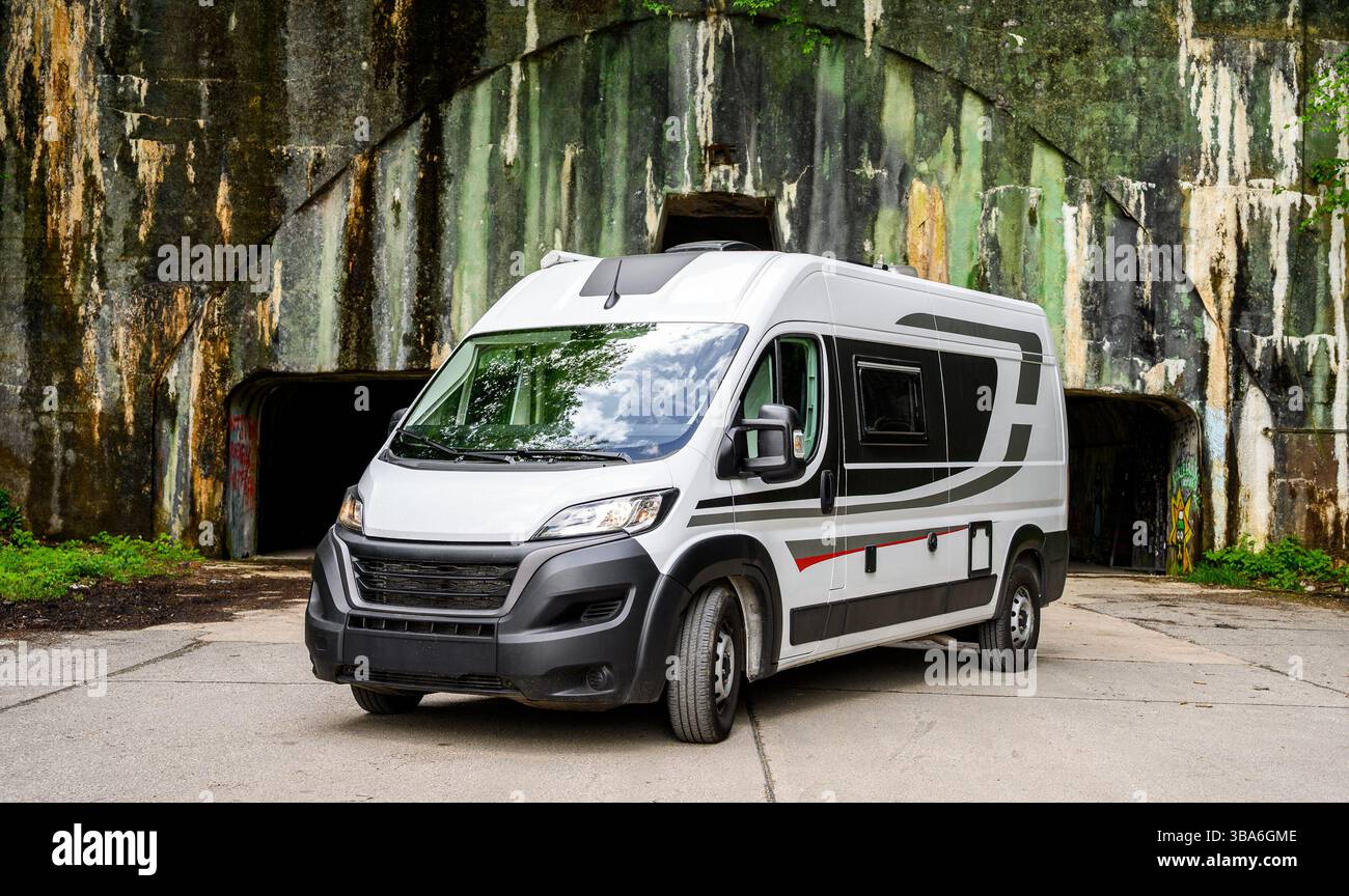 Campervan or motorhome parked at abandoned airbase Zeljava in Croatia ...