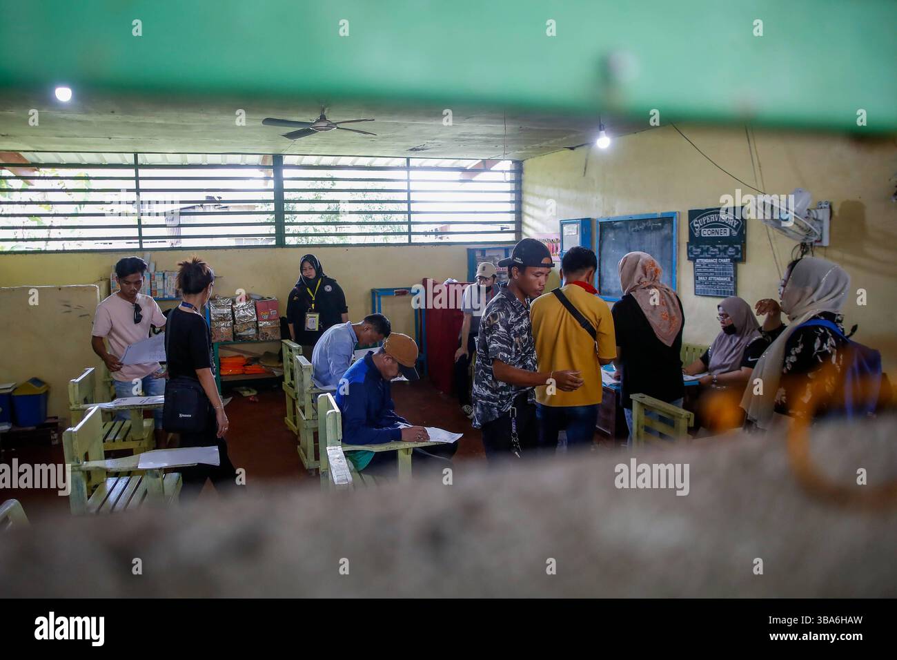 Midterm elections in Philippines People cast their vote at a school ...