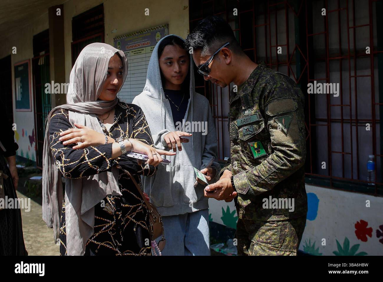Midterm elections in Philippines A soldier checks the fingers for ...