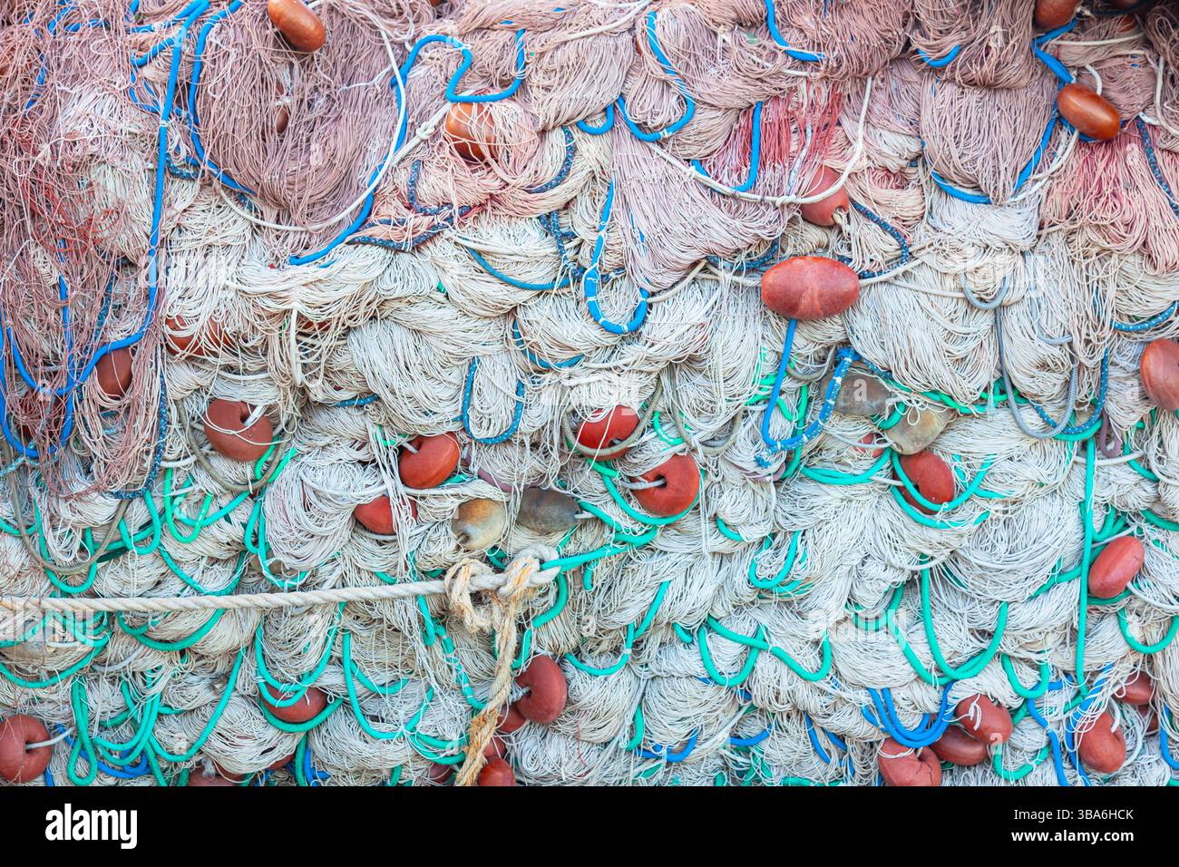 Large pile of fishing nets with floats Stock Photo - Alamy