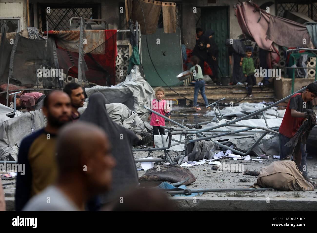 Palestinians inspect the rubble of A school Fatima, Asad s daughter ...