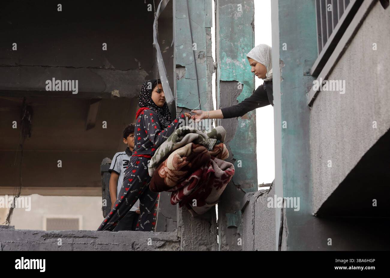 Palestinians inspect the rubble of A school Fatima, Asad s daughter ...