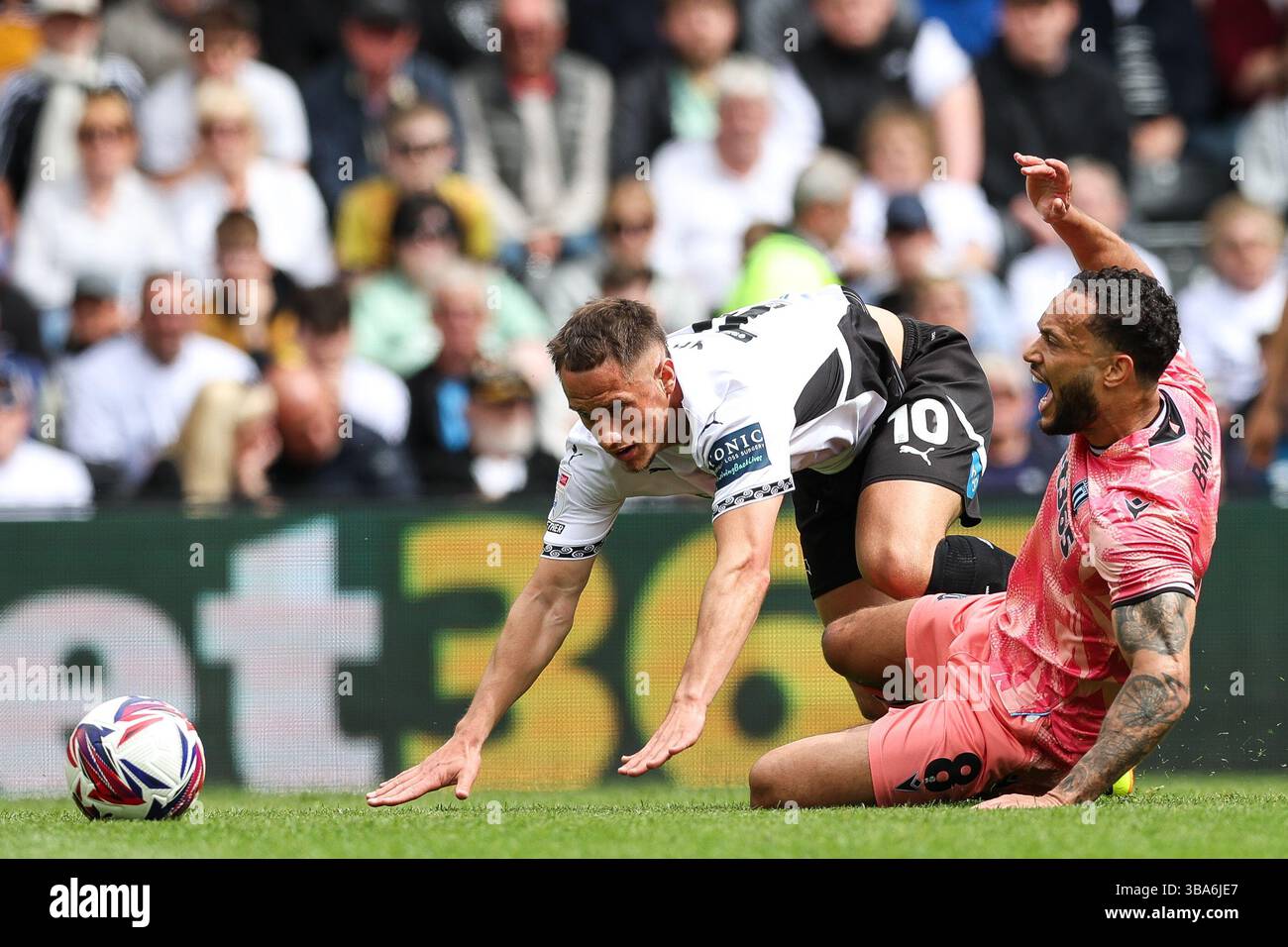 Derby County's Jerry Yates (left) and Stoke City's Lewis Baker battle ...