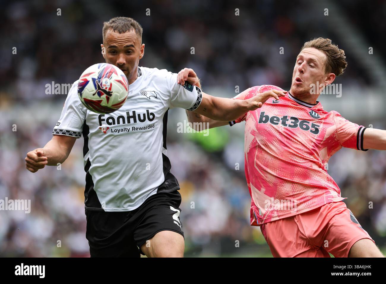 Derby County's Kane Wilson (left) and Stoke City's Wouter Burger battle ...