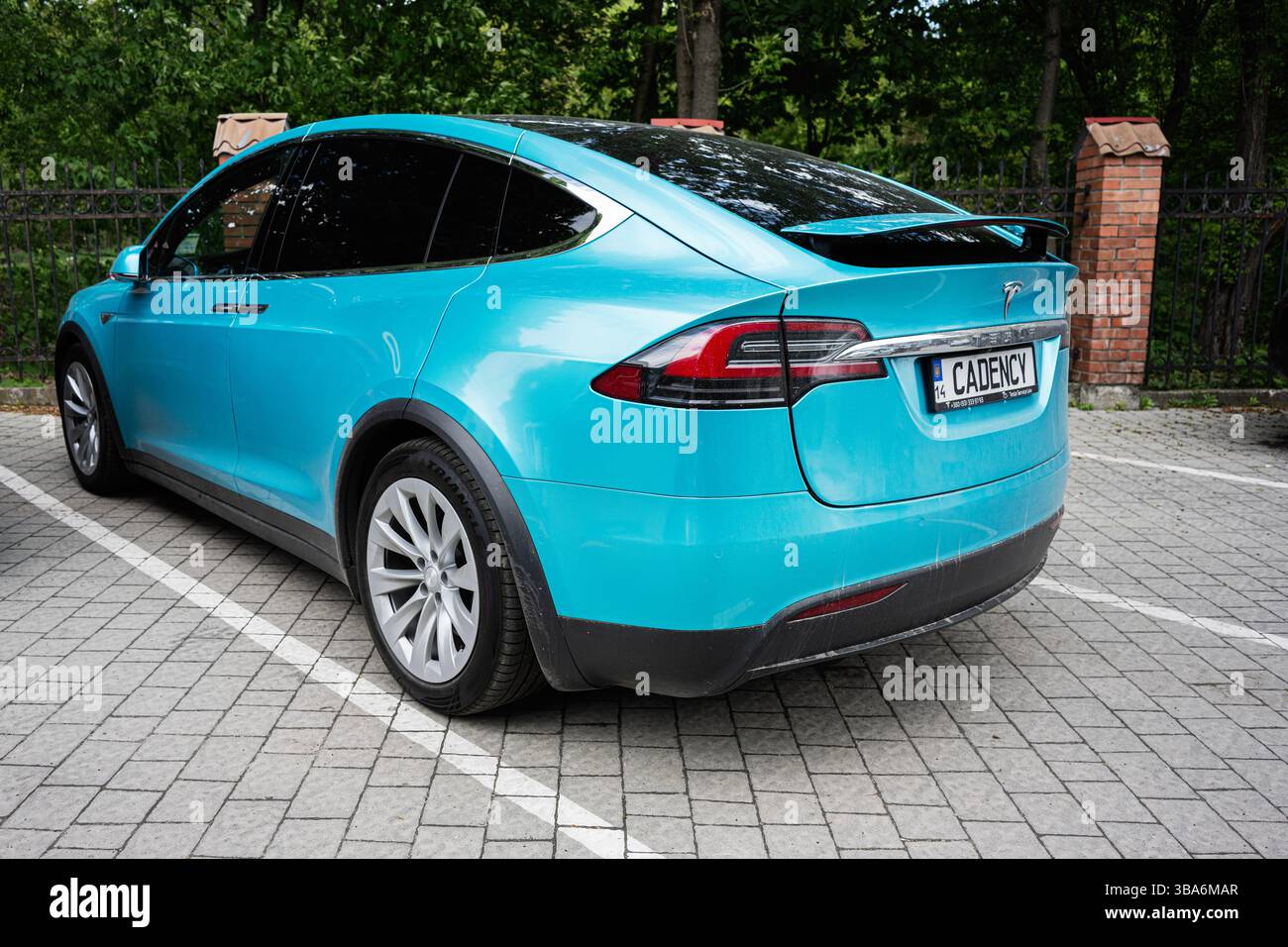 Lviv, Ukraine - May 04, 2025: Teal electric Tesla Model Y crossover ...
