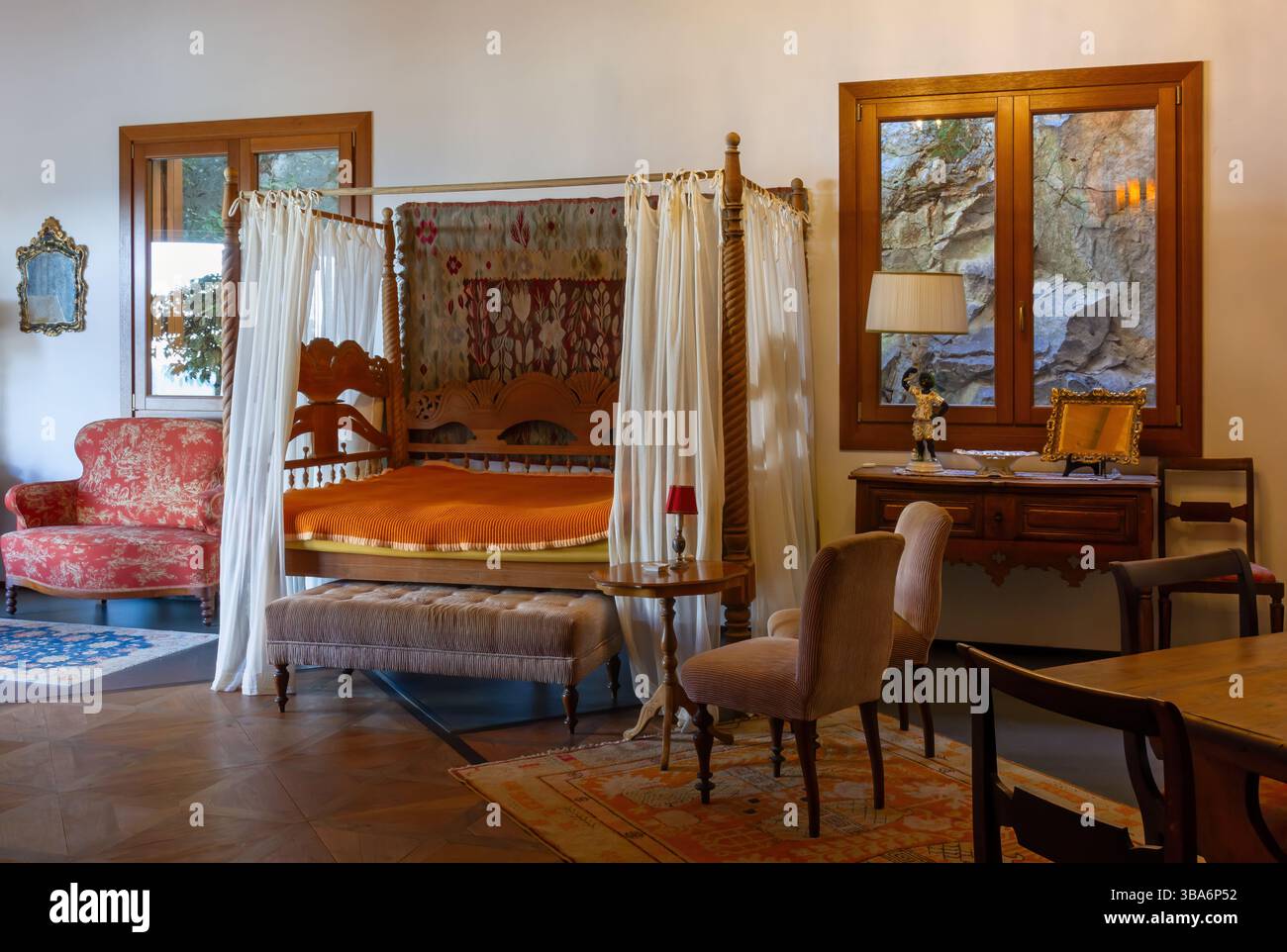 Open-space interior finely decorated with classical-style furniture ...