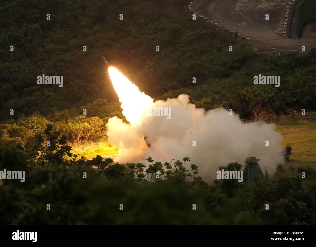 A rocket practice round is launched from a M142 High Mobility Artillery ...