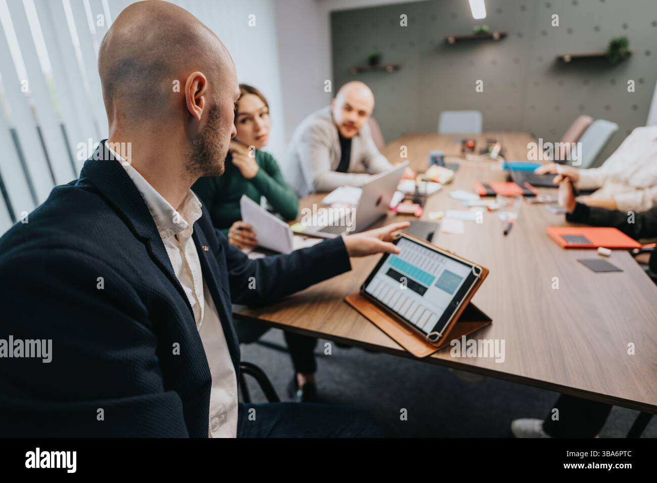 Collaborative business meeting with employees discussing insights and ...