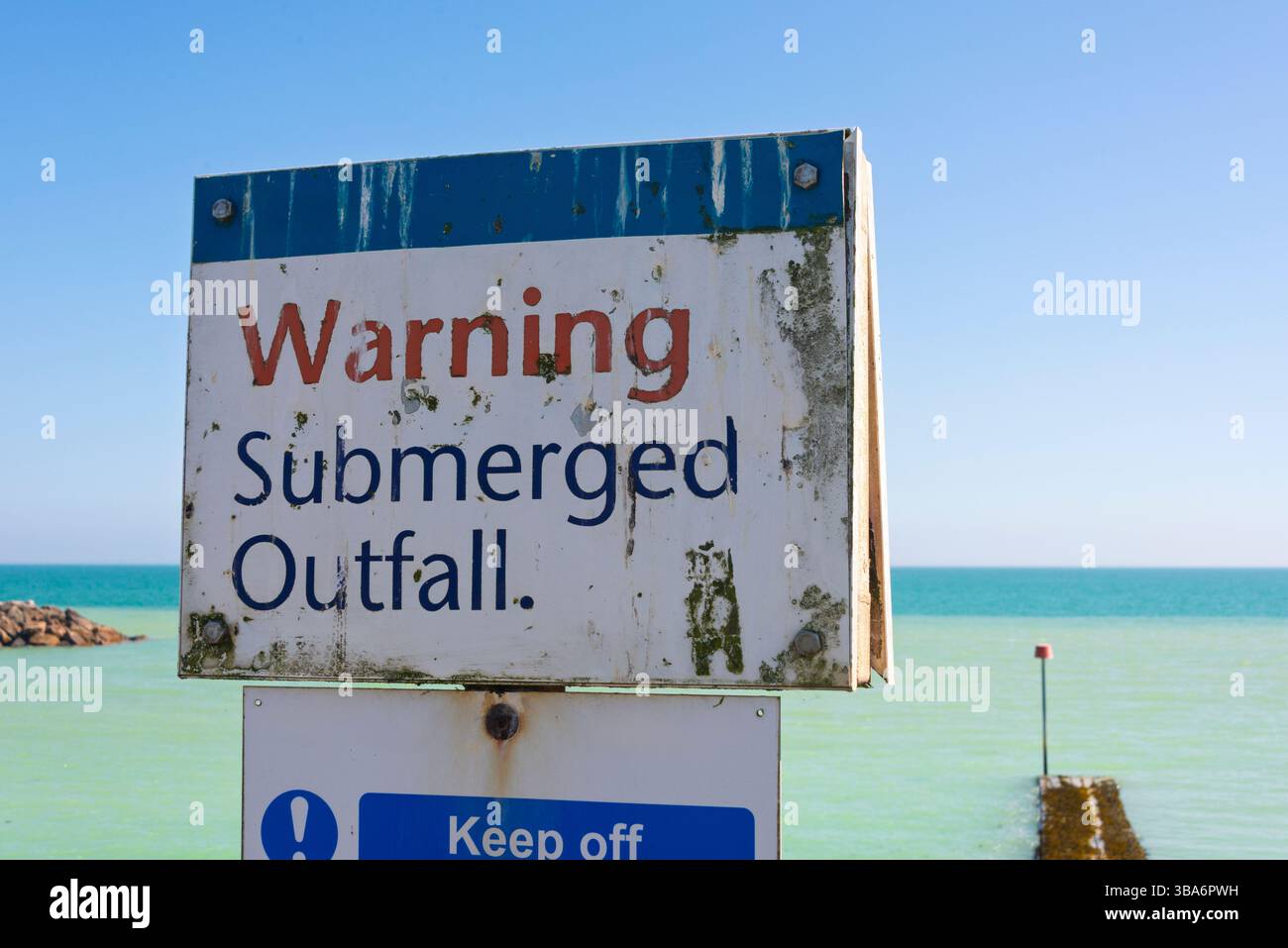 warning submerged outfall sign by the coast Stock Photo - Alamy