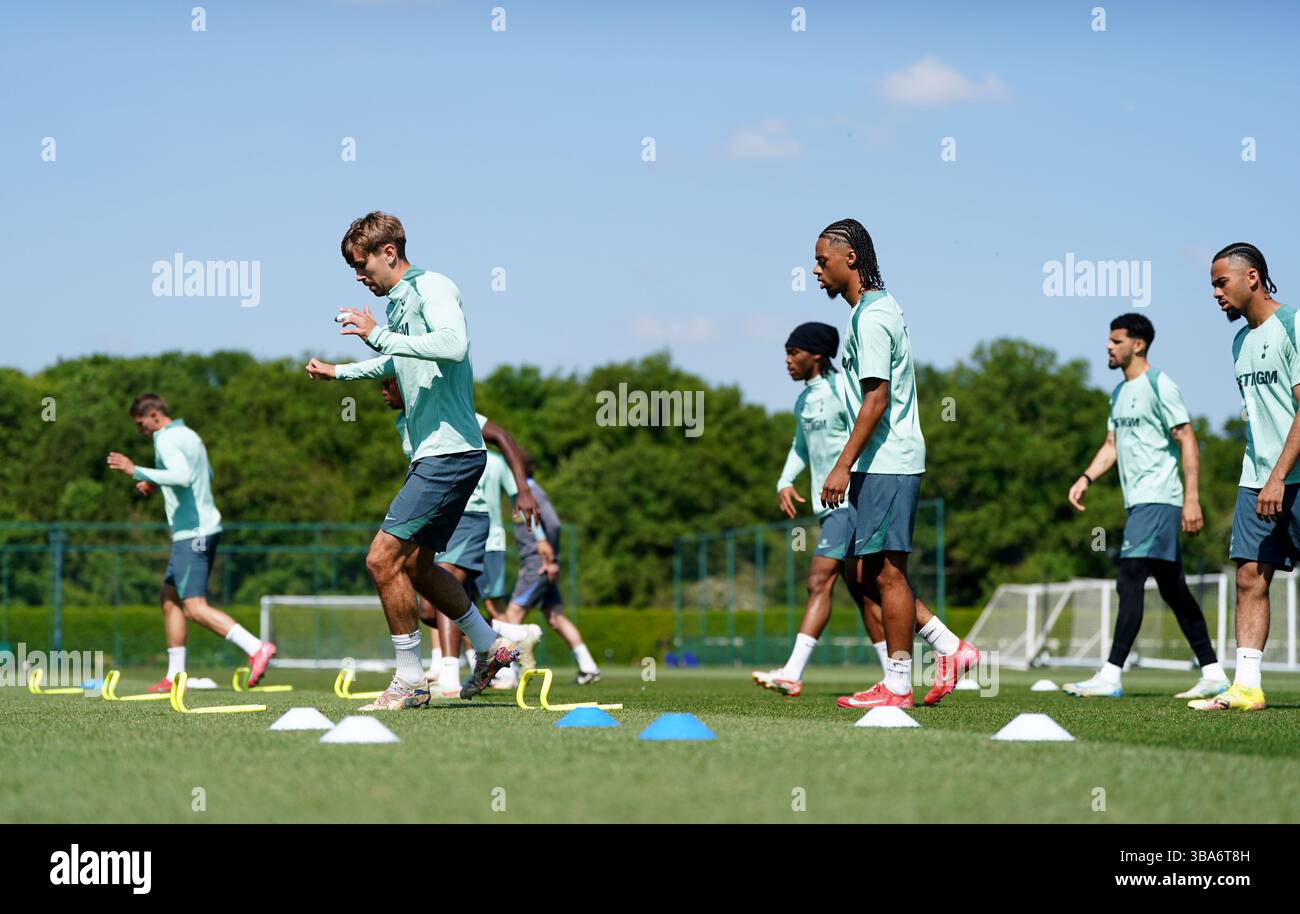 Tottenham Hotspur players warm up during a training session at ...