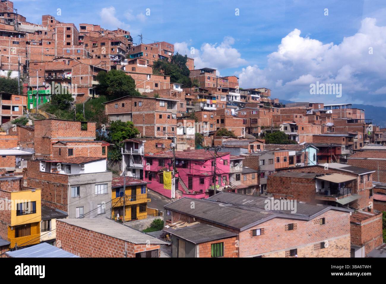 Cable car view of the hillside slums of Comuna 13, in Medellin ...