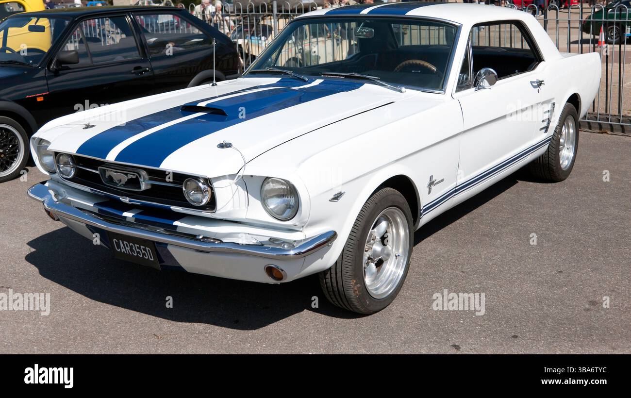 Three-quarters Front View of a White, 1966, Ford Mustang, on display at ...